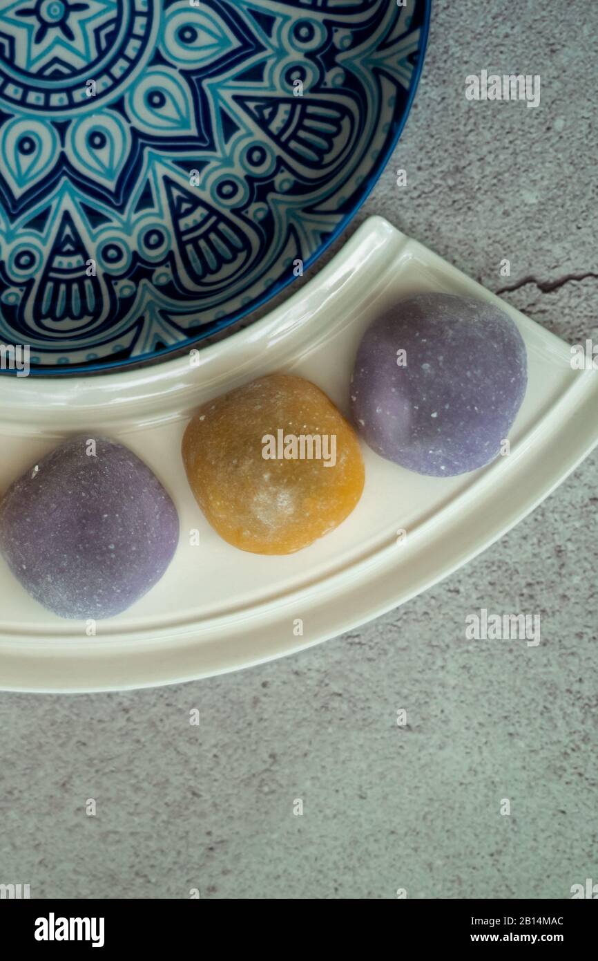 Multi-colored Japanese Mochi in rice dough and on a beautiful plate and ...
