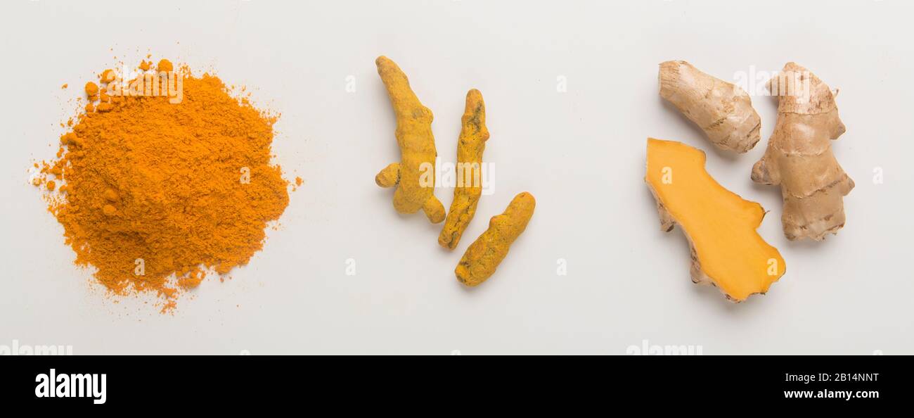 Turmeric extract powder and root on white background Stock Photo - Alamy