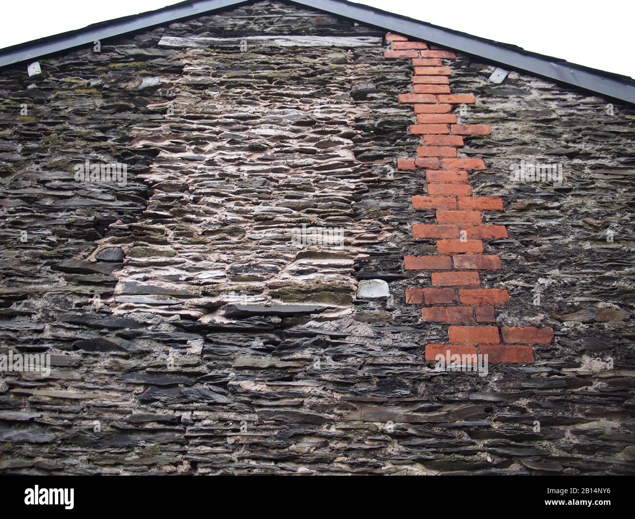 Repaired stone gable, Macynlleth, Wales Stock Photo - Alamy