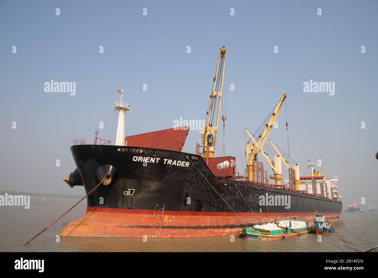 Foreign cargo vessel anchored on the Poshur River near the Mongla Sea ...