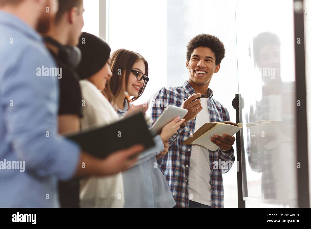 Learning concept. Friends discussing math equations together Stock ...