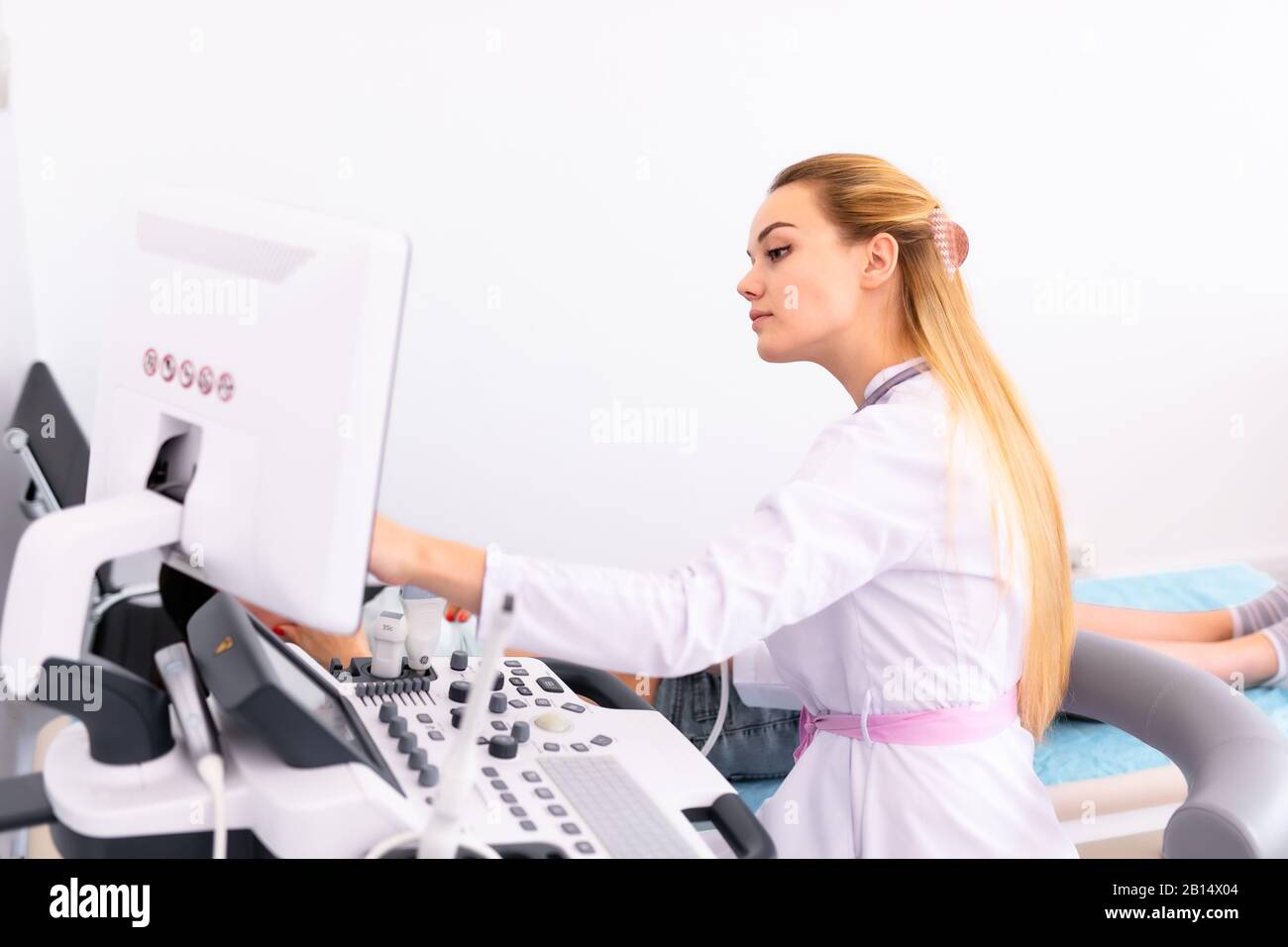 Ultrasound sensor of modern ultrasonic scanner in young woman doctor's ...