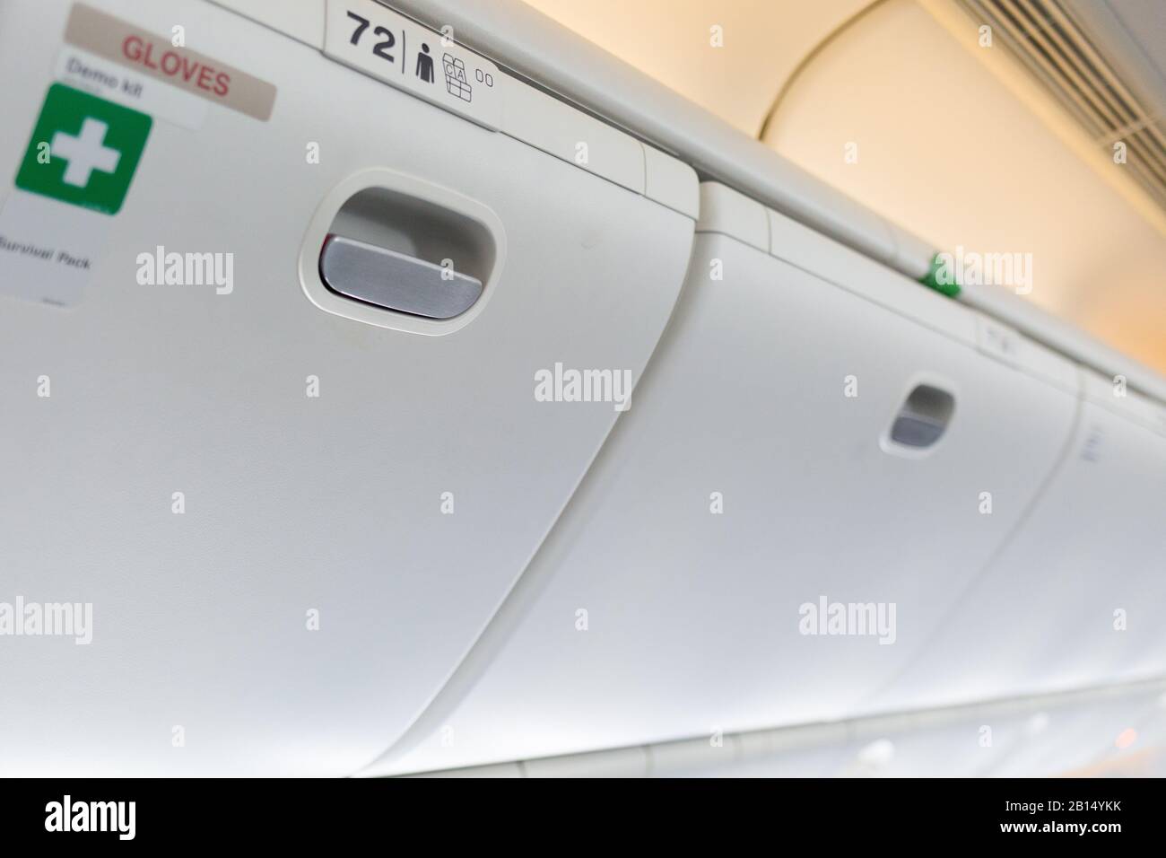 Overhead locker airplane hi-res stock photography and images - Alamy