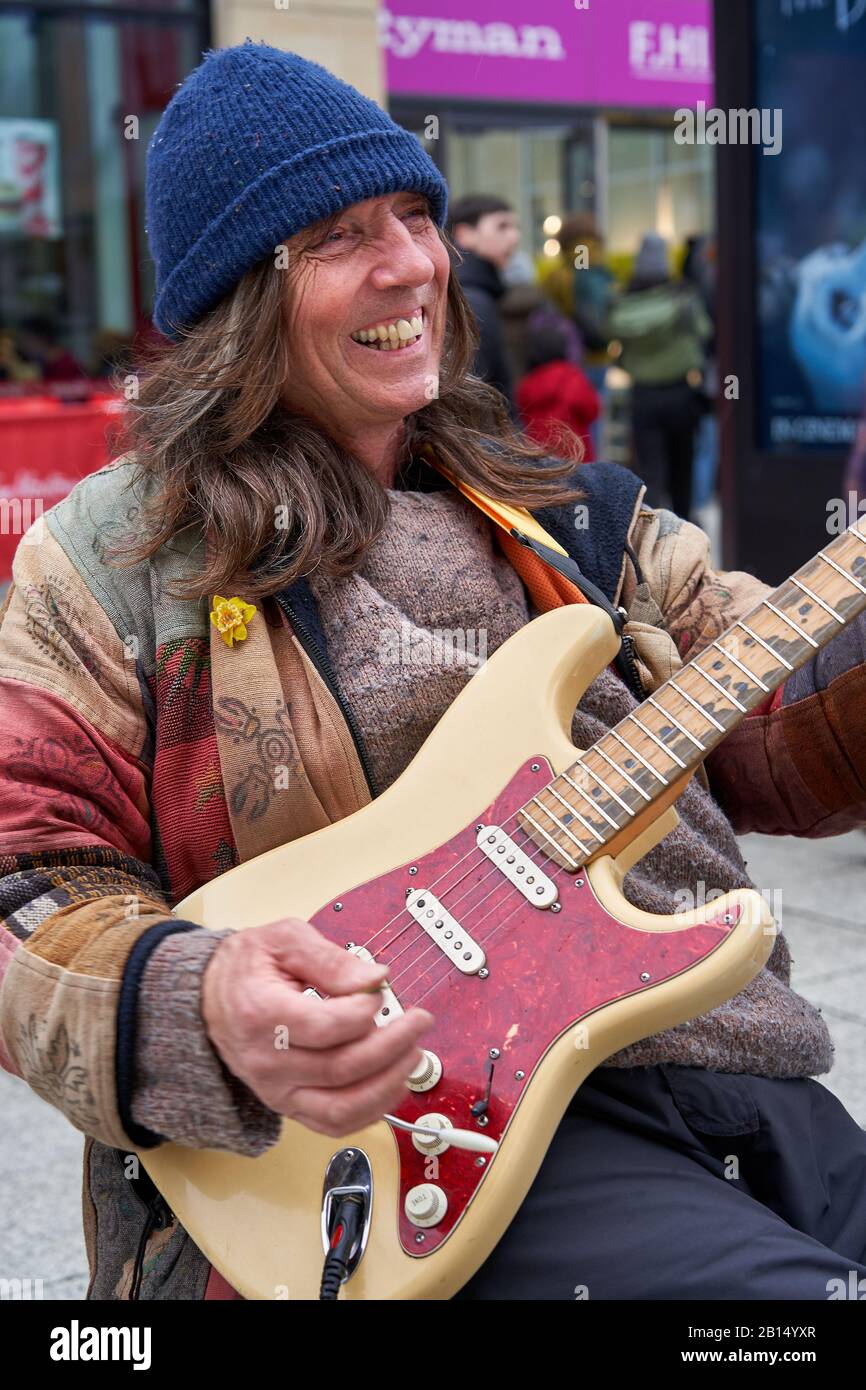 Guitarist Mark Allen busking on Queen Street, Cardiff, South Wales ...