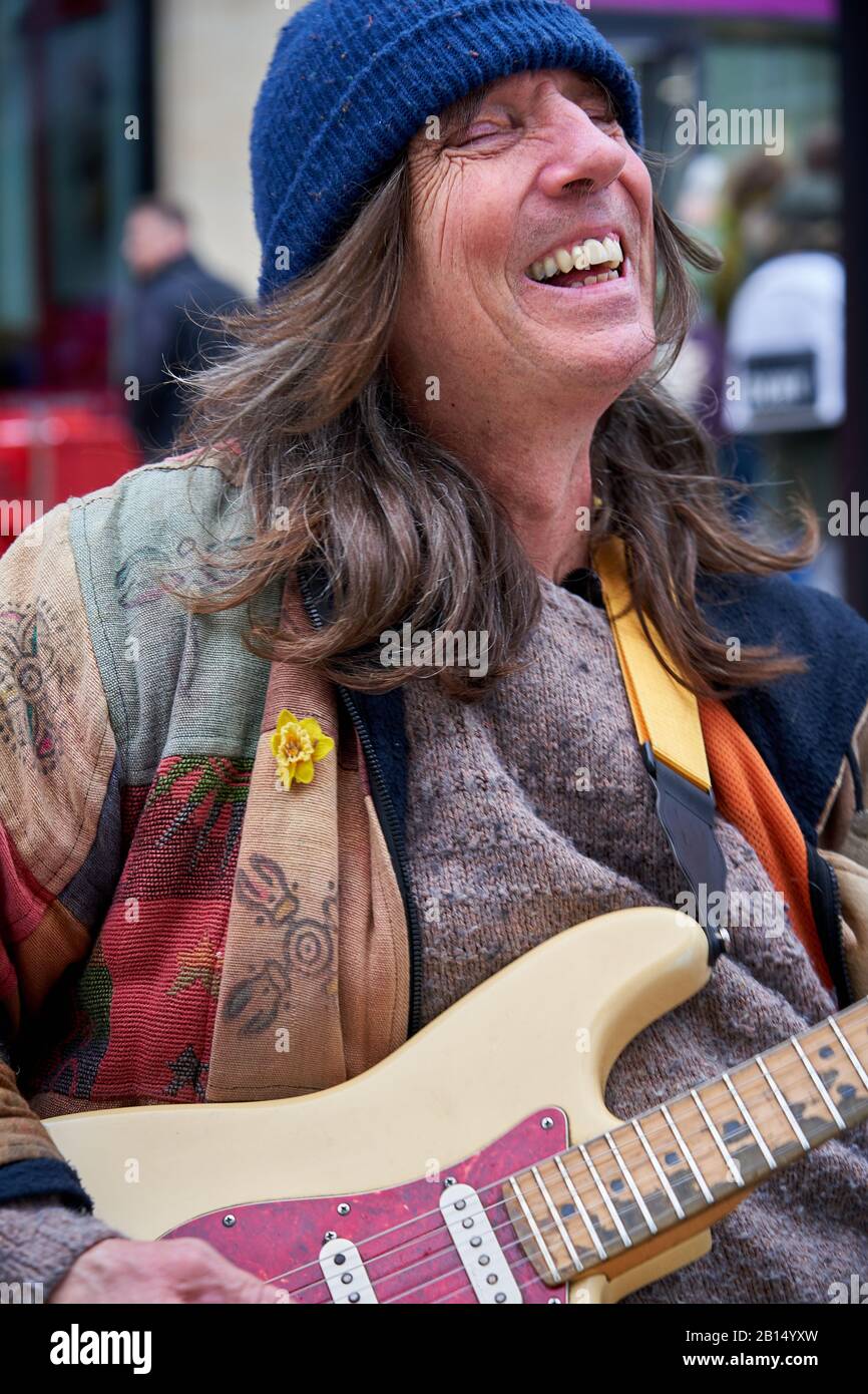 Guitarist Mark Allen busking on Queen Street, Cardiff, South Wales ...