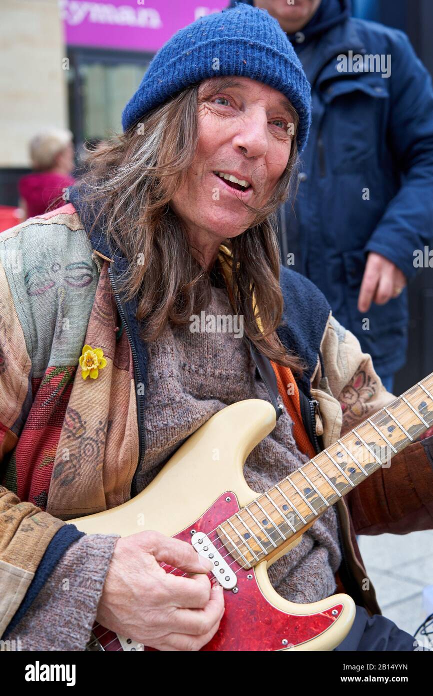 Guitarist Mark Allen busking on Queen Street, Cardiff, South Wales ...