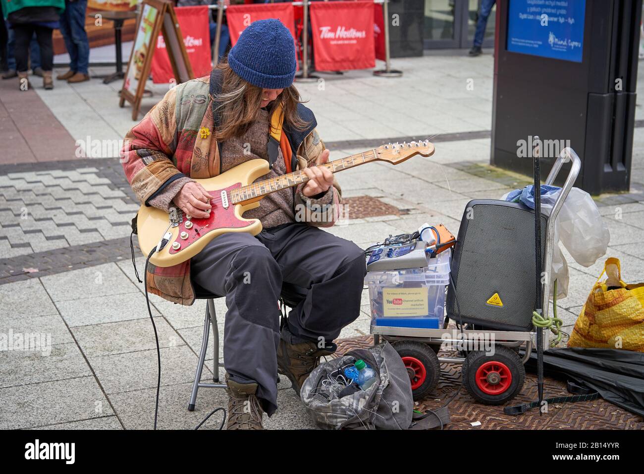 Guitarist Mark Allen busking on Queen Street, Cardiff, South Wales ...