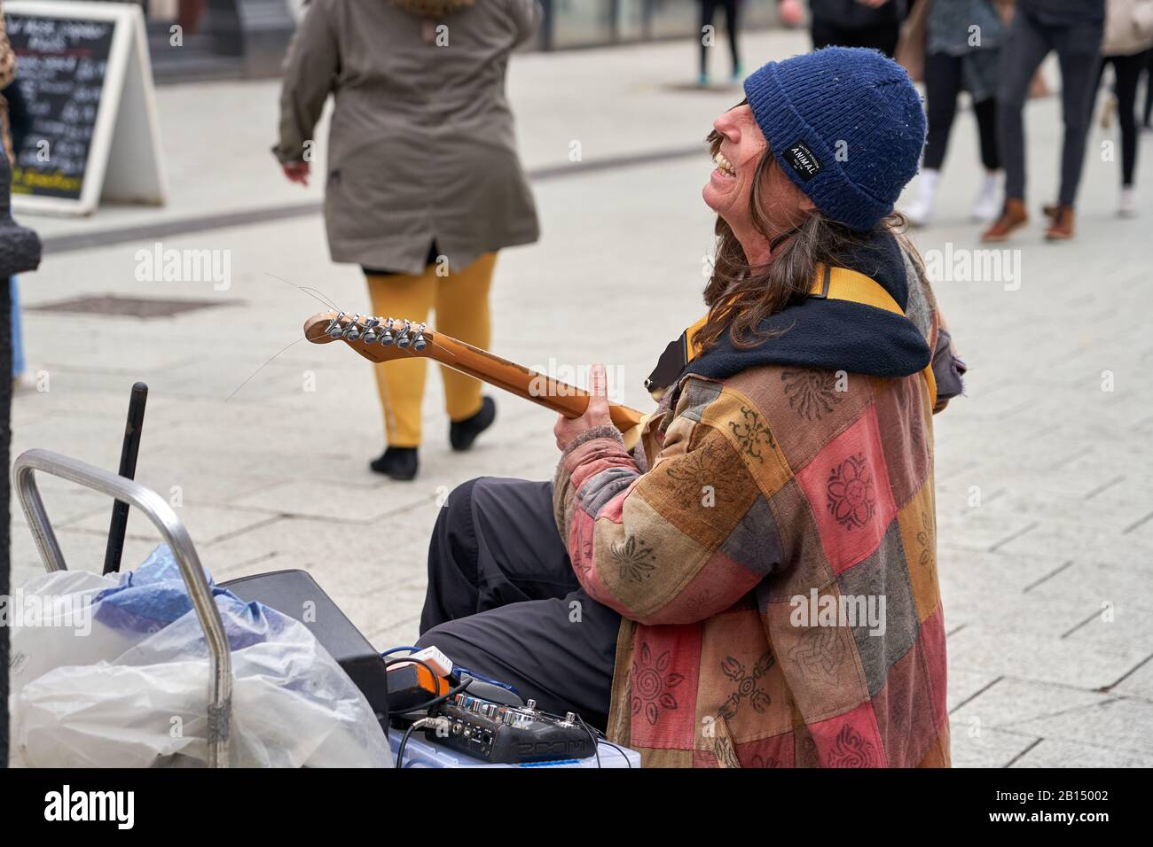 Guitarist Mark Allen busking on Queen Street, Cardiff, South Wales ...