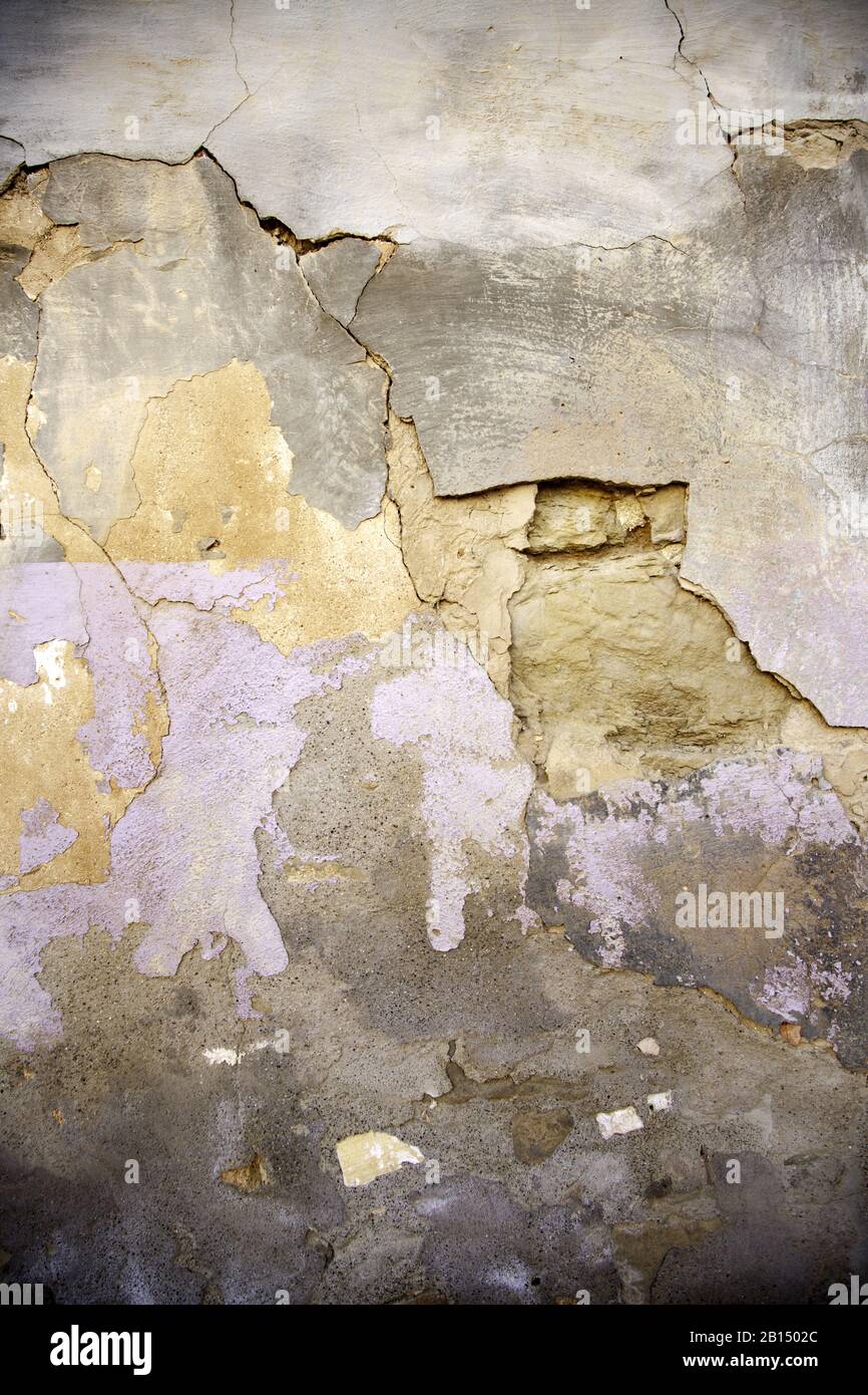 Peeling painted wall, detail of the passage of time, abandonment and ...
