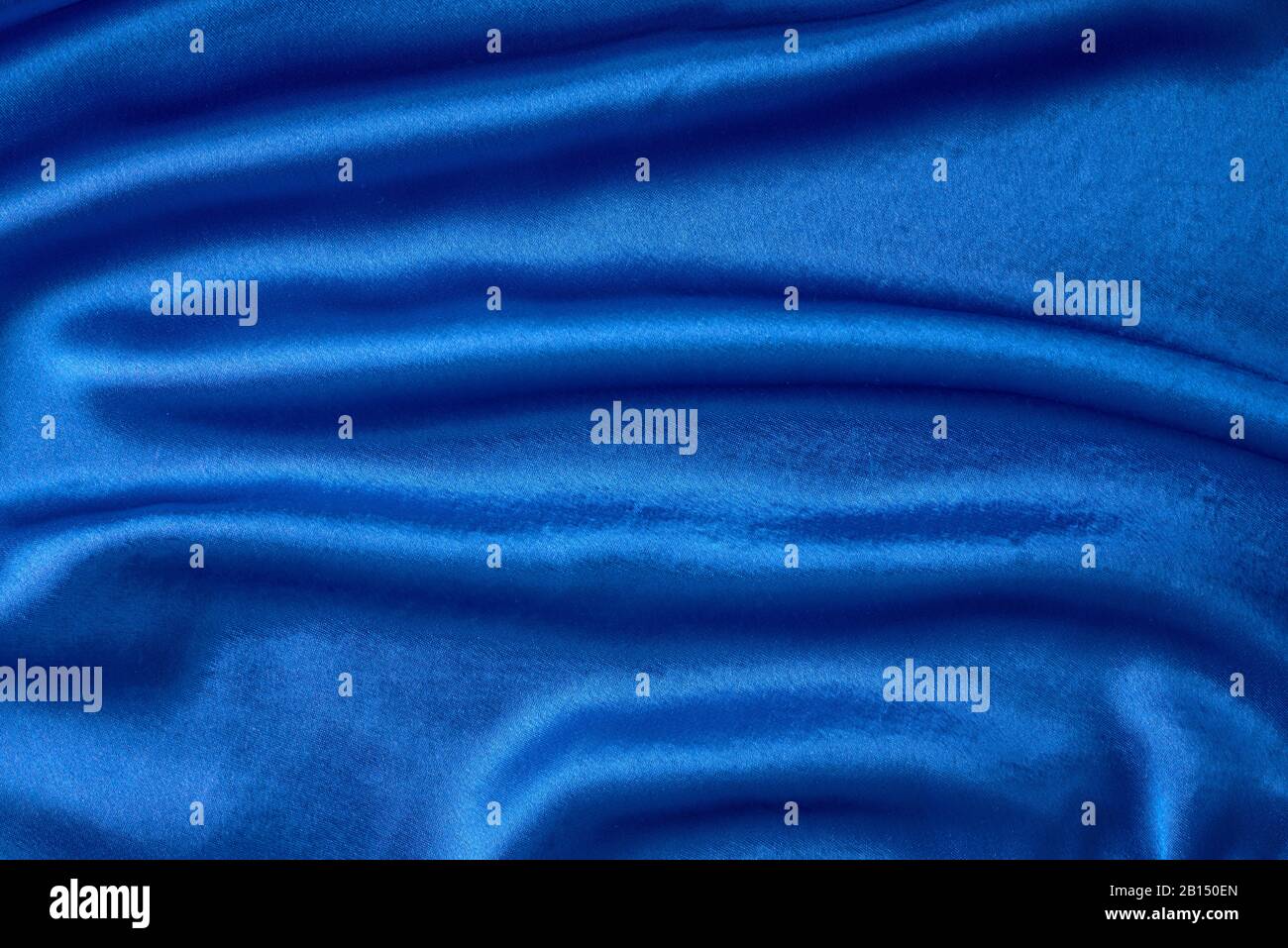 Blue silk background with folds. Abstract texture of rippled satin ...