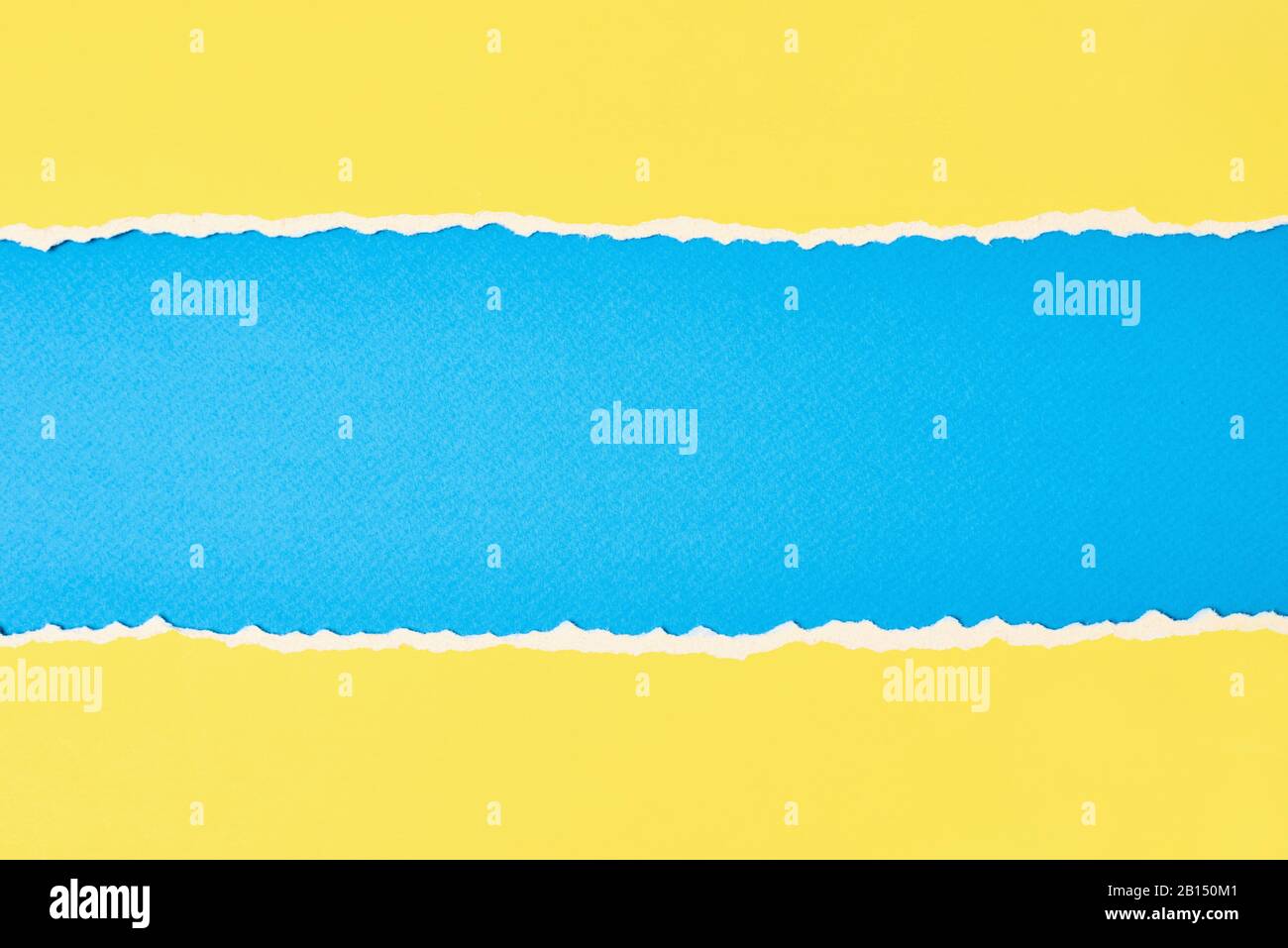 Torn ripped paper edge with copy space, color blue and yellow ...