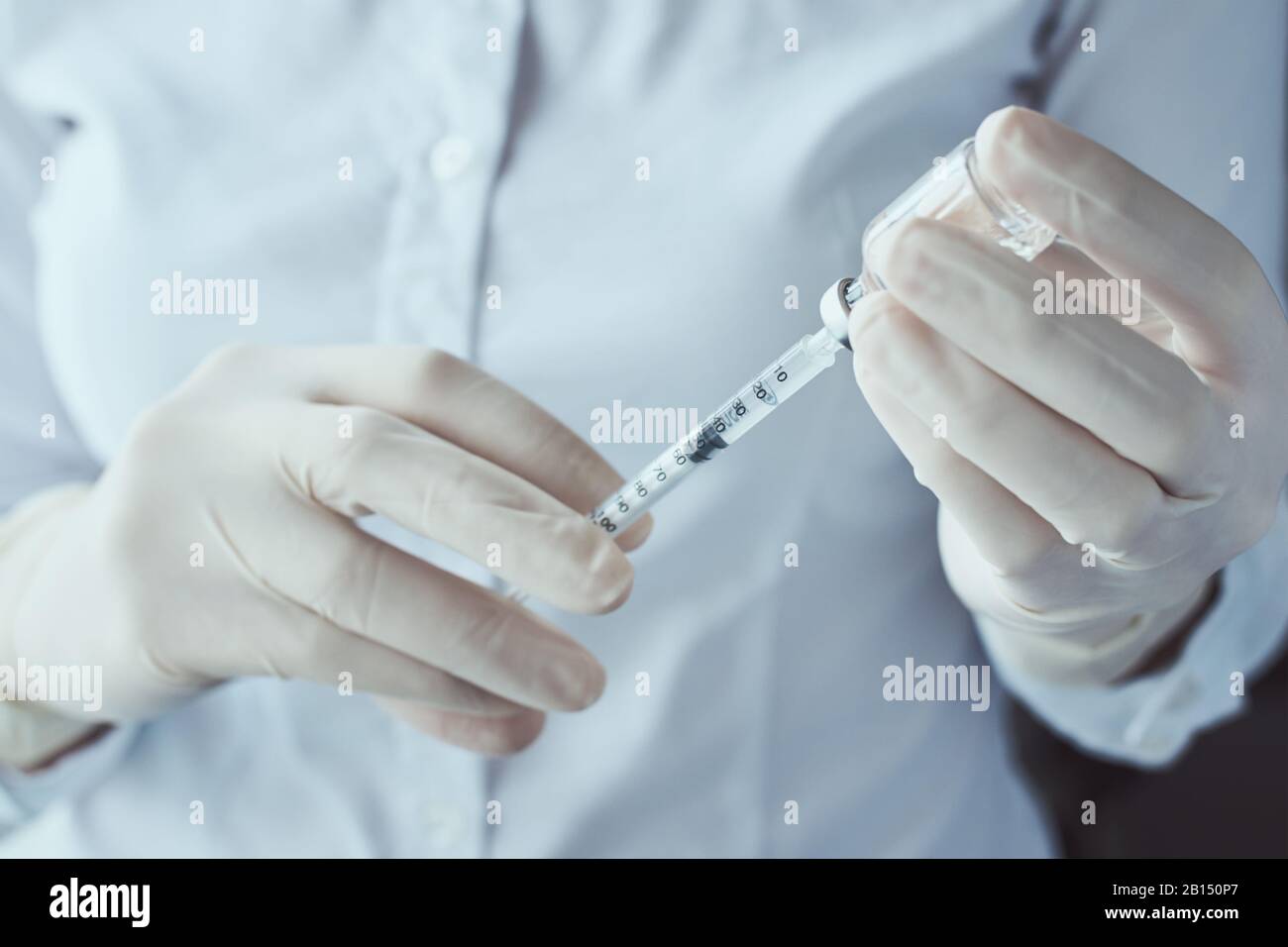 Woman hold an injection syringe and medicine vial ampoule. Healthcare ...