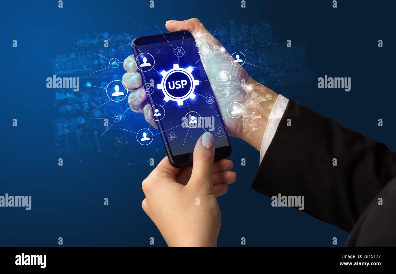 Female hand holding smartphone with USP abbreviation, modern technology ...