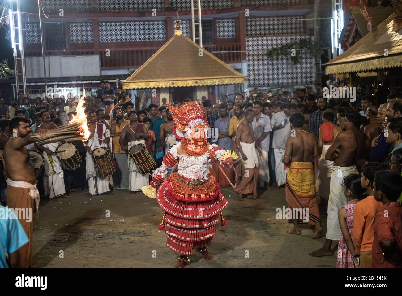 Theyyam performer, as a living god, dances a popular ritual form of ...
