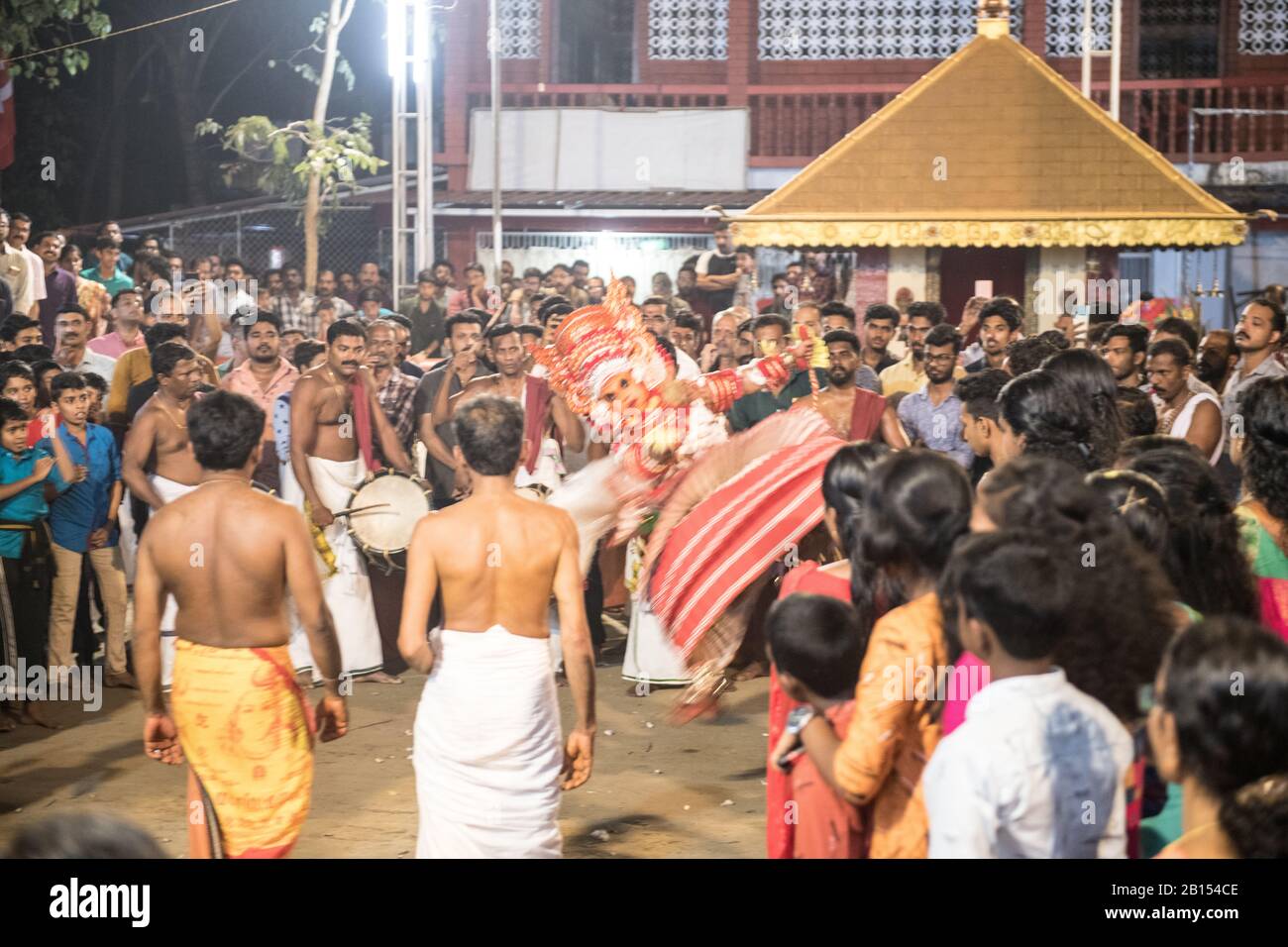 Theyyam performer, as a living god, dances a popular ritual form of ...
