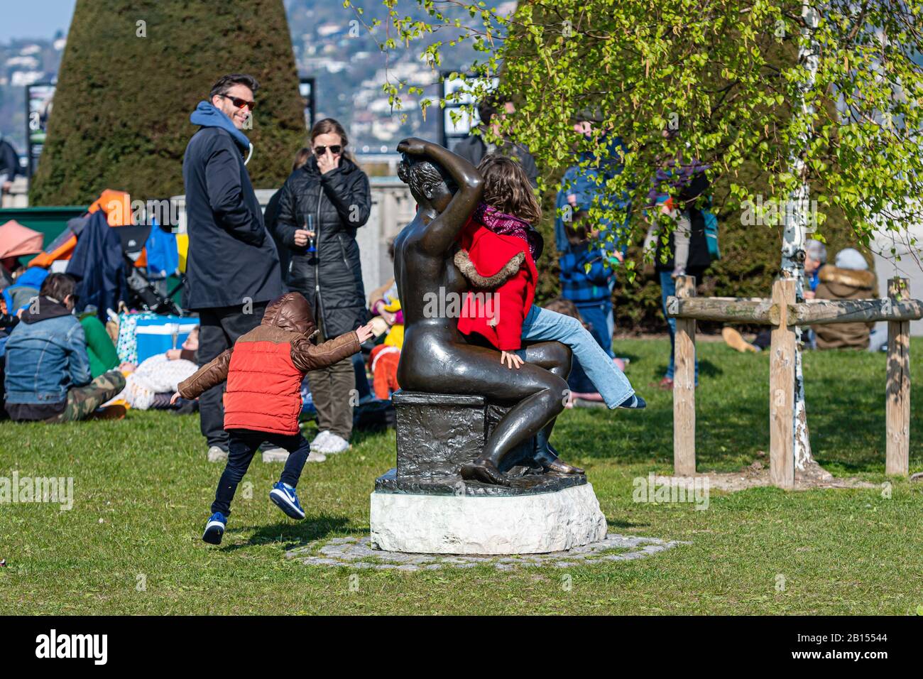 Geneva, Switzerland - April 14, 2019: People enjoy the first warm ...