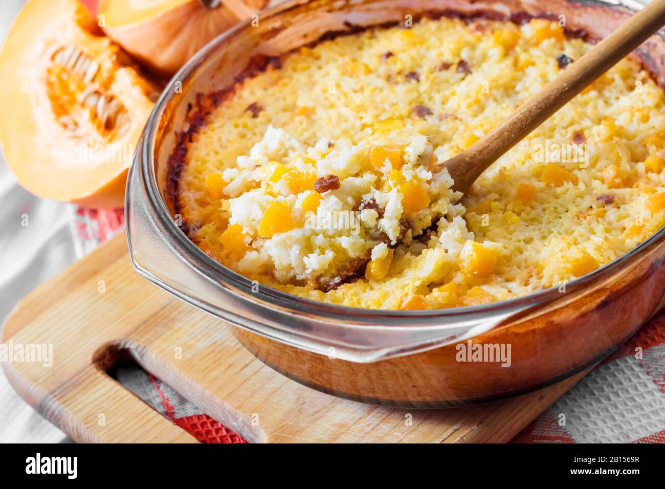Baked sweet milky millet and rice porridge with pumpkin and raisins in ...