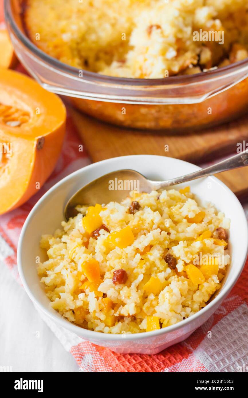 Sweet milky millet and rice porridge with pumpkin and raisins Stock ...