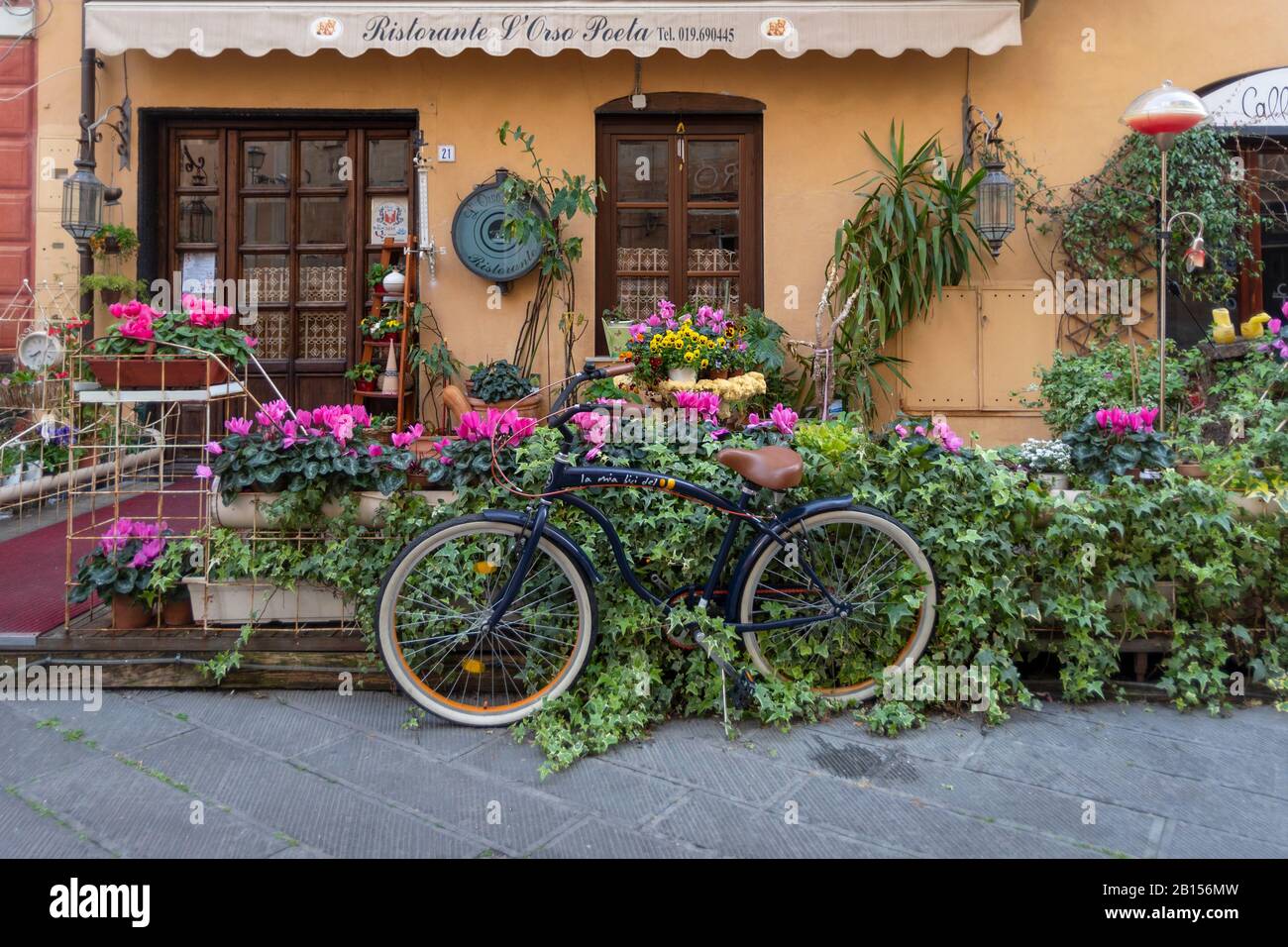 Flower bike in Finalborgo medieval village, Liguria region, Italy Stock ...