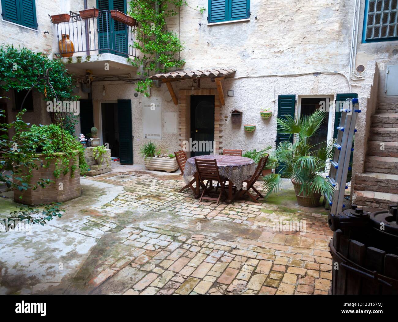 old hidden house courtyard (nobody around Stock Photo - Alamy