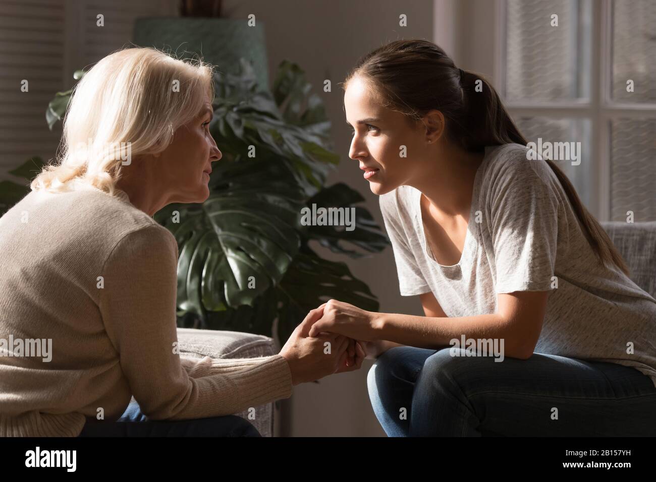Daughter sitting opposite hi-res stock photography and images - Alamy