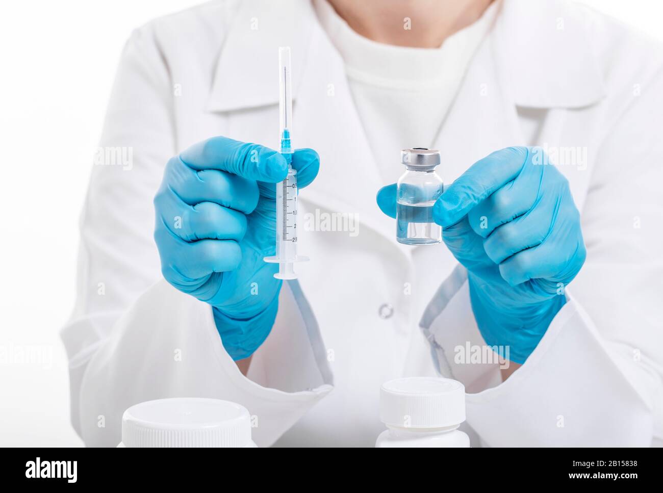 Person holding vaccine vial hi-res stock photography and images - Alamy