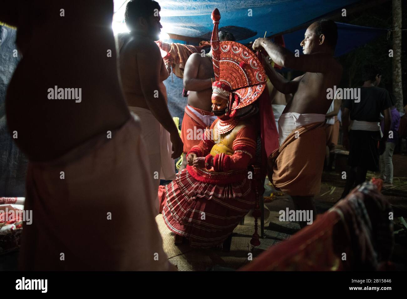 Preparing for Theyyam performance - a popular ritual form of worship in North Kerala, near ...