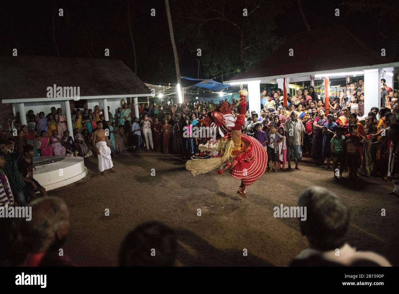 Theyyam performer, as a living god, dances a popular ritual form of ...