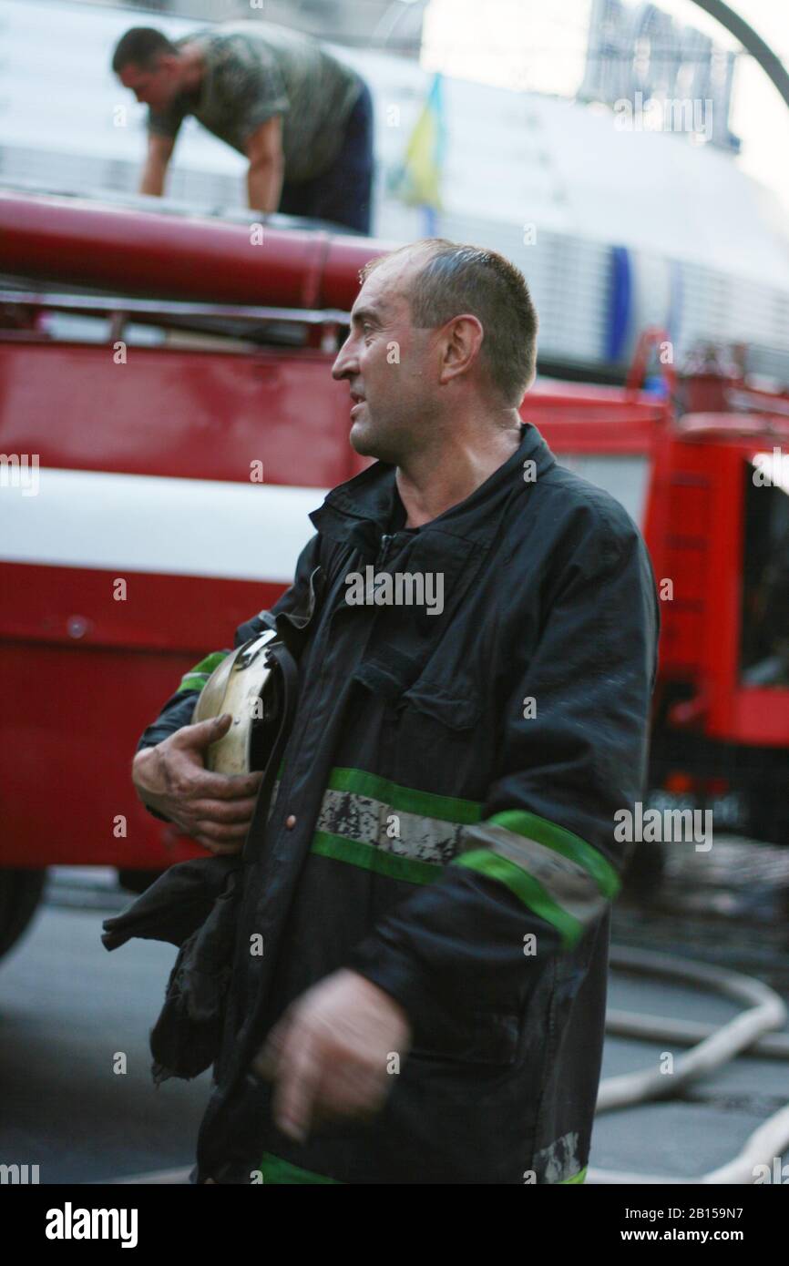 At the scene of a fire in a building. Firefighters Work Concept Stock ...