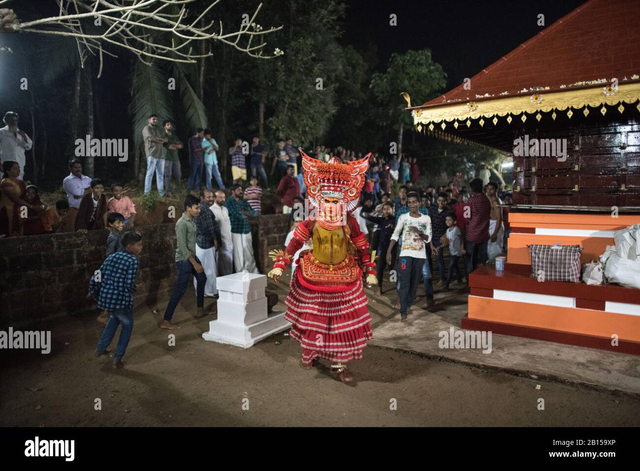 Theyyam performer, as a living god, dances a popular ritual form of ...