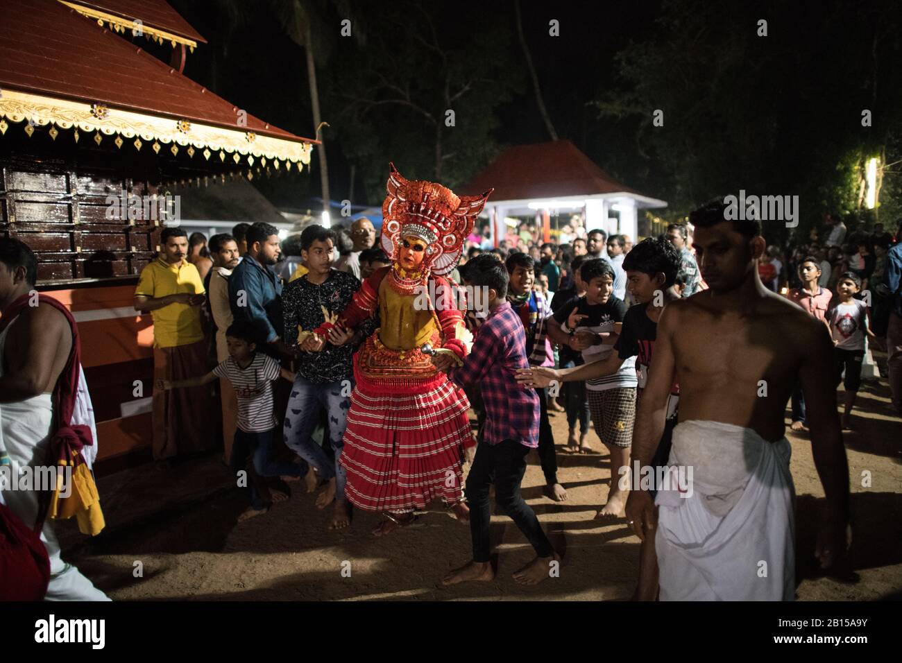 Theyyam performer, as a living god, dances a popular ritual form of ...