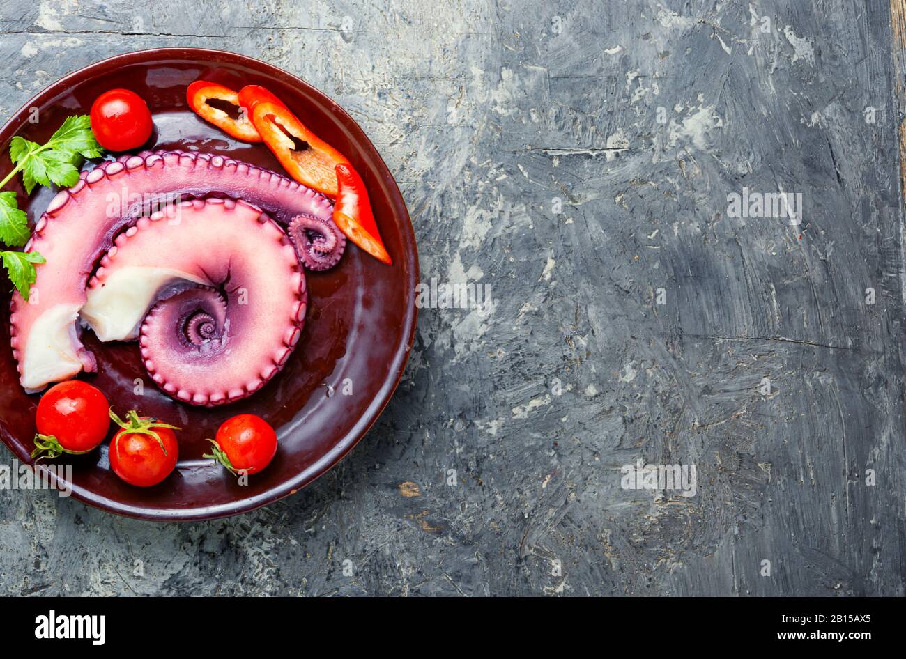 Tentacles of raw octopus.Seafood.Raw octopus ready for cooking.Flat lay ...