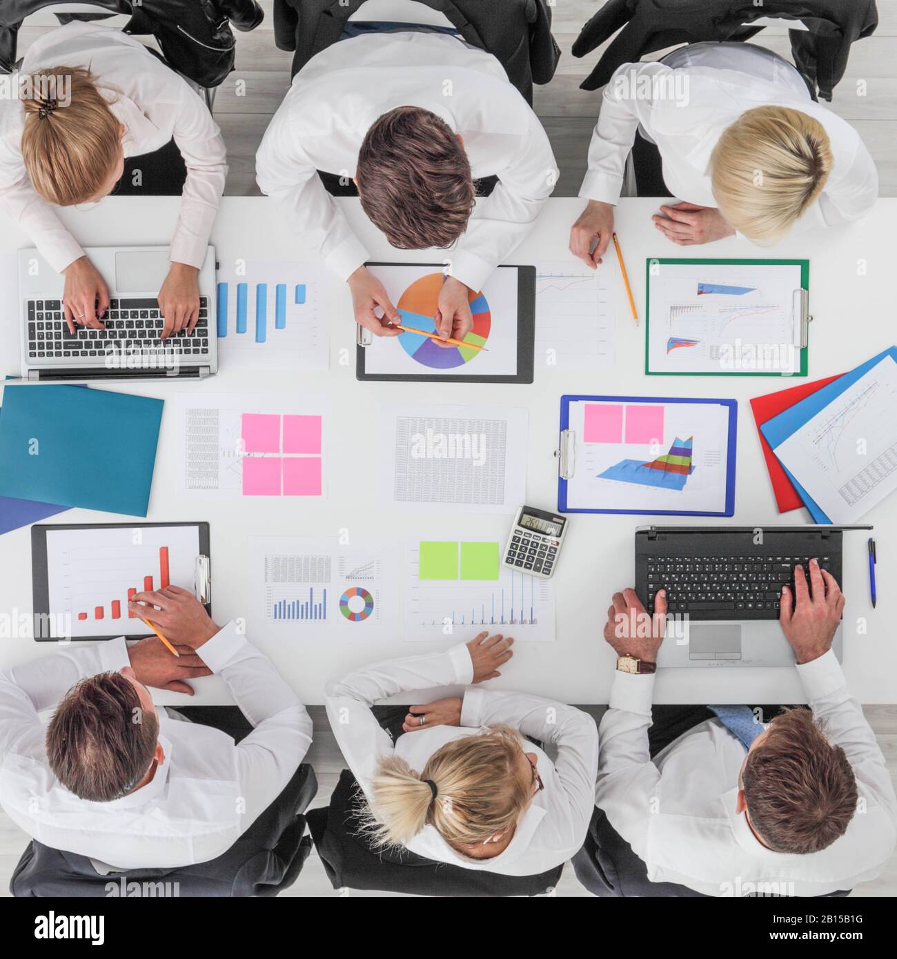 Businessman sitting desk diagrams hi-res stock photography and images ...