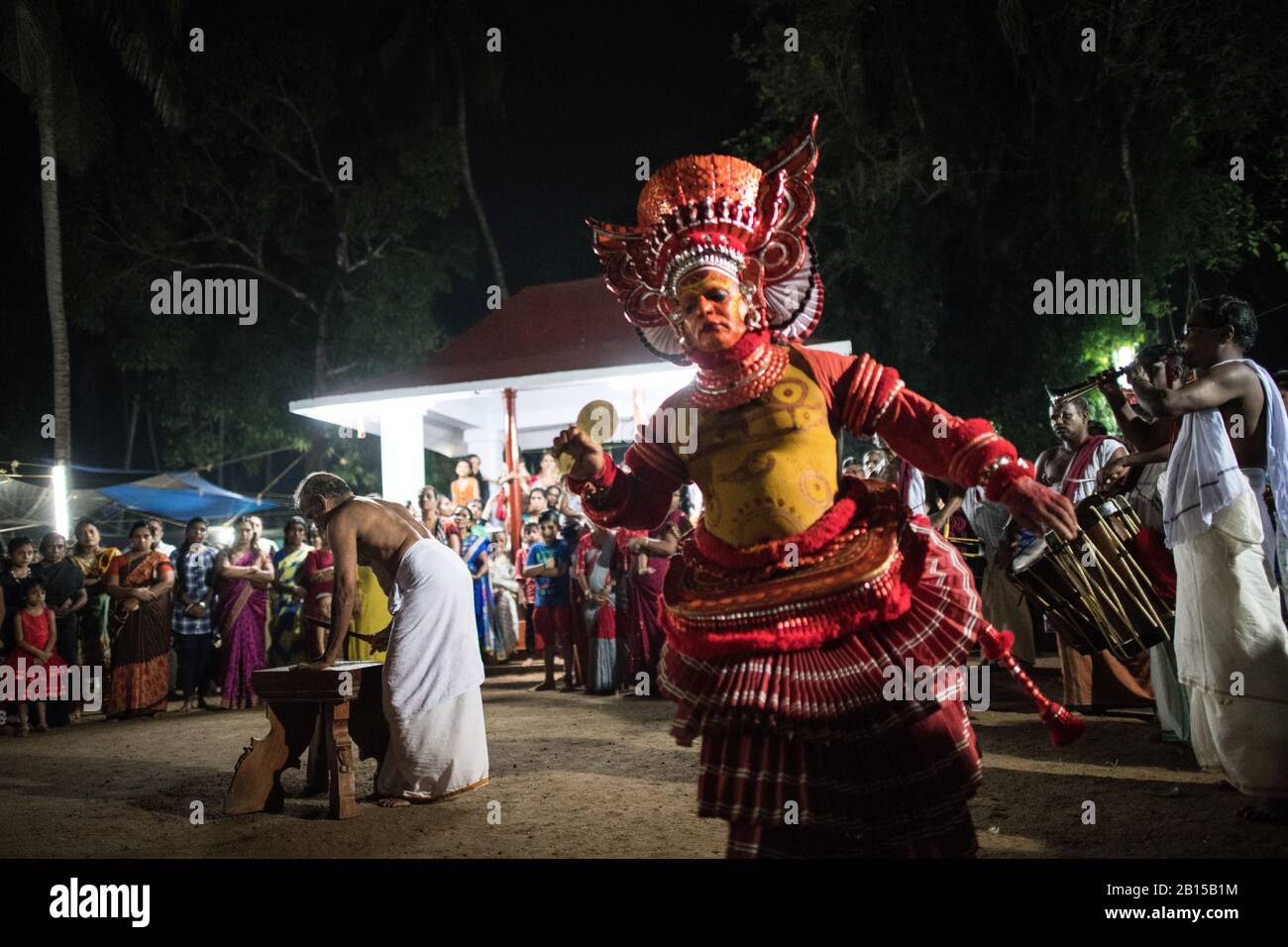 Theyyam performer, as a living god, dances a popular ritual form of ...