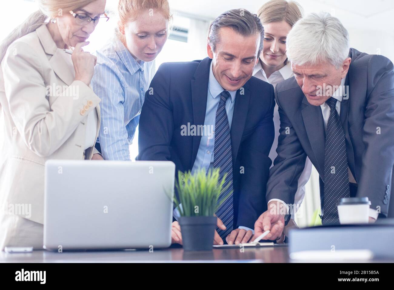 Team work process, business people sign contract documents standing ...