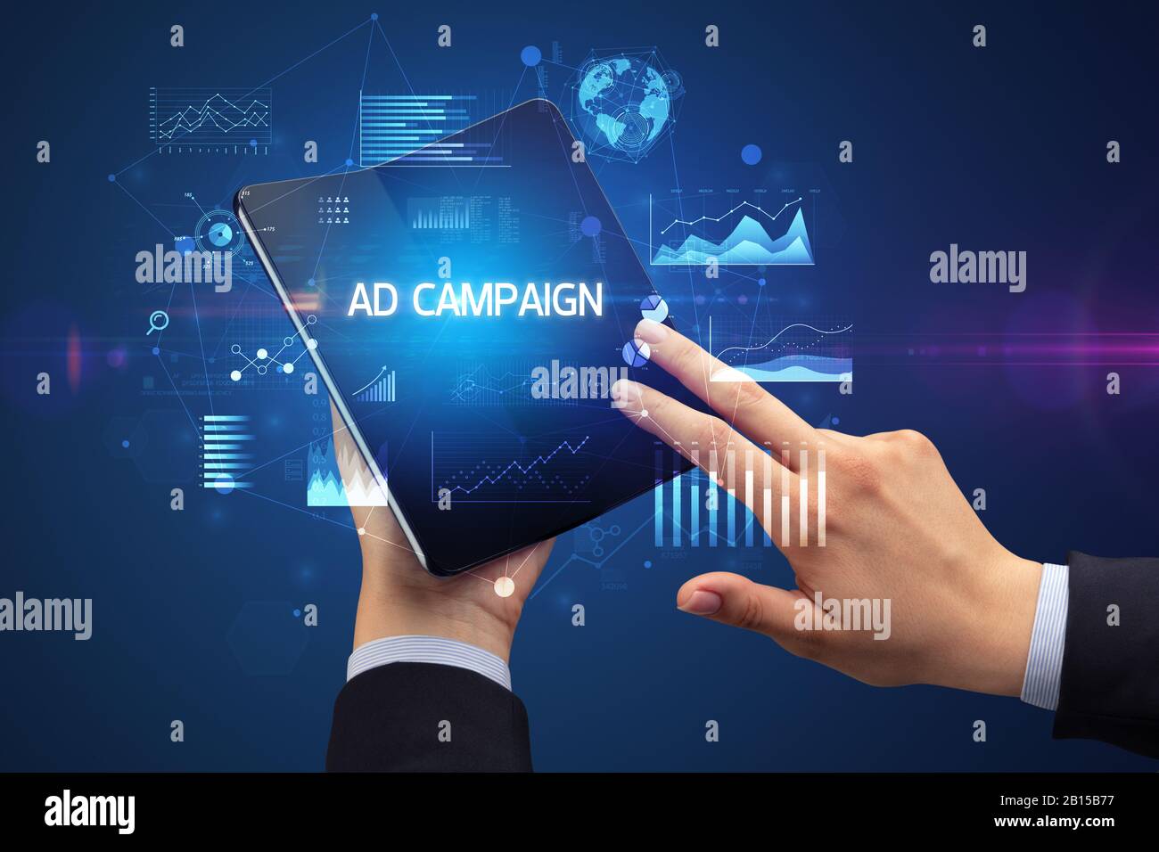 Businessman holding a foldable smartphone with AD CAMPAIGN inscription ...