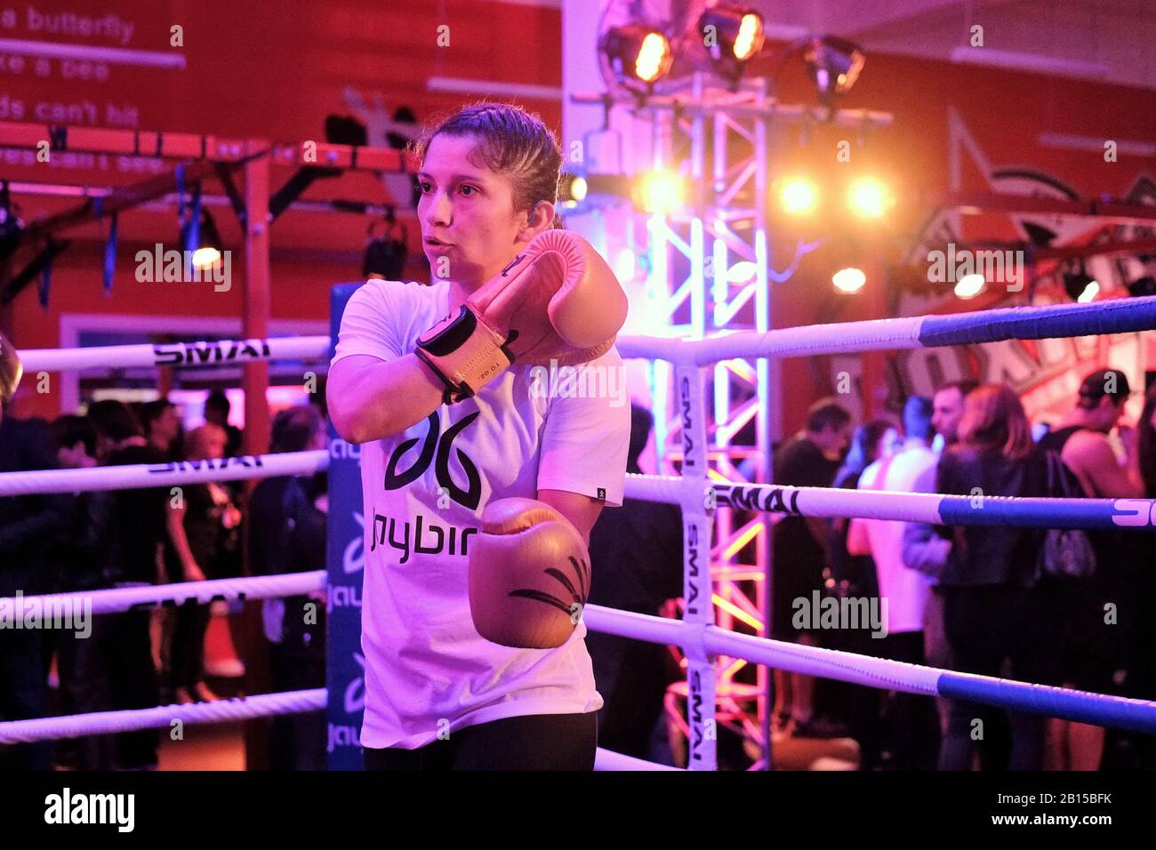 A women athlete sparring and training in a boxing ring, sports ...