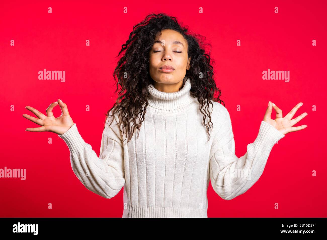 Calm african girl with turquoise hair relaxing, meditating. Woman calms ...