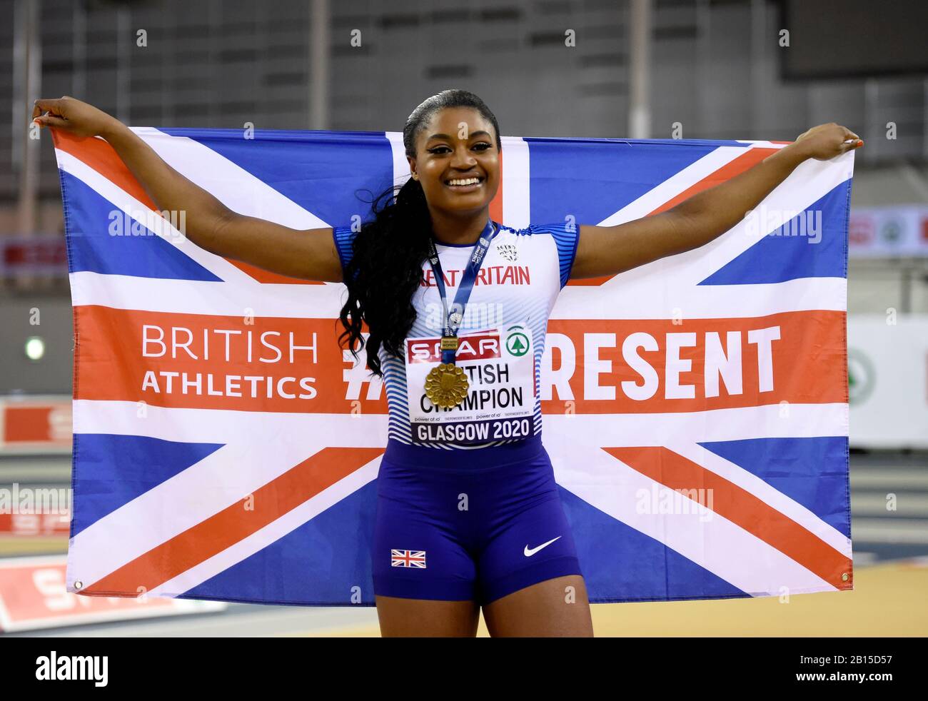 Naomi Ogbeta celebrates winning gold in the Women's Triple Jump during ...