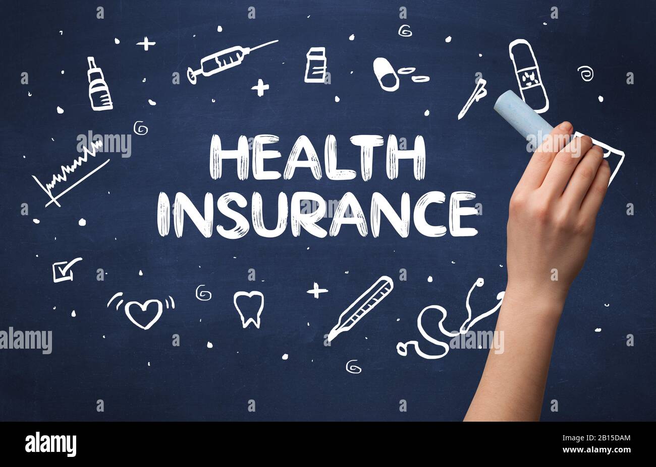 Hand drawing HEALTH INSURANCE inscription with white chalk on ...