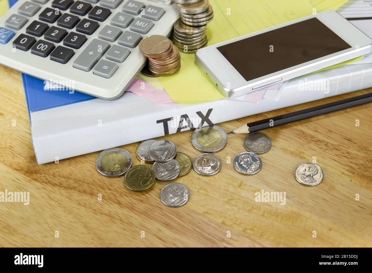 Folder Tax documents and paper files with calculator,coin concept ...