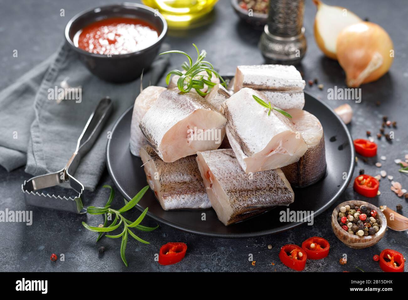 Raw fresh sliced hake fish with ingredients for cooking Stock Photo - Alamy