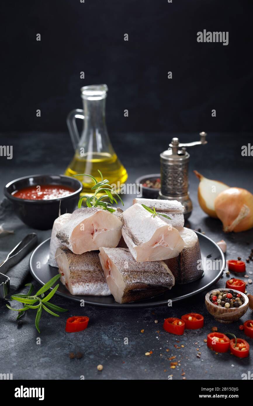 Raw fresh sliced hake fish with ingredients for cooking Stock Photo - Alamy