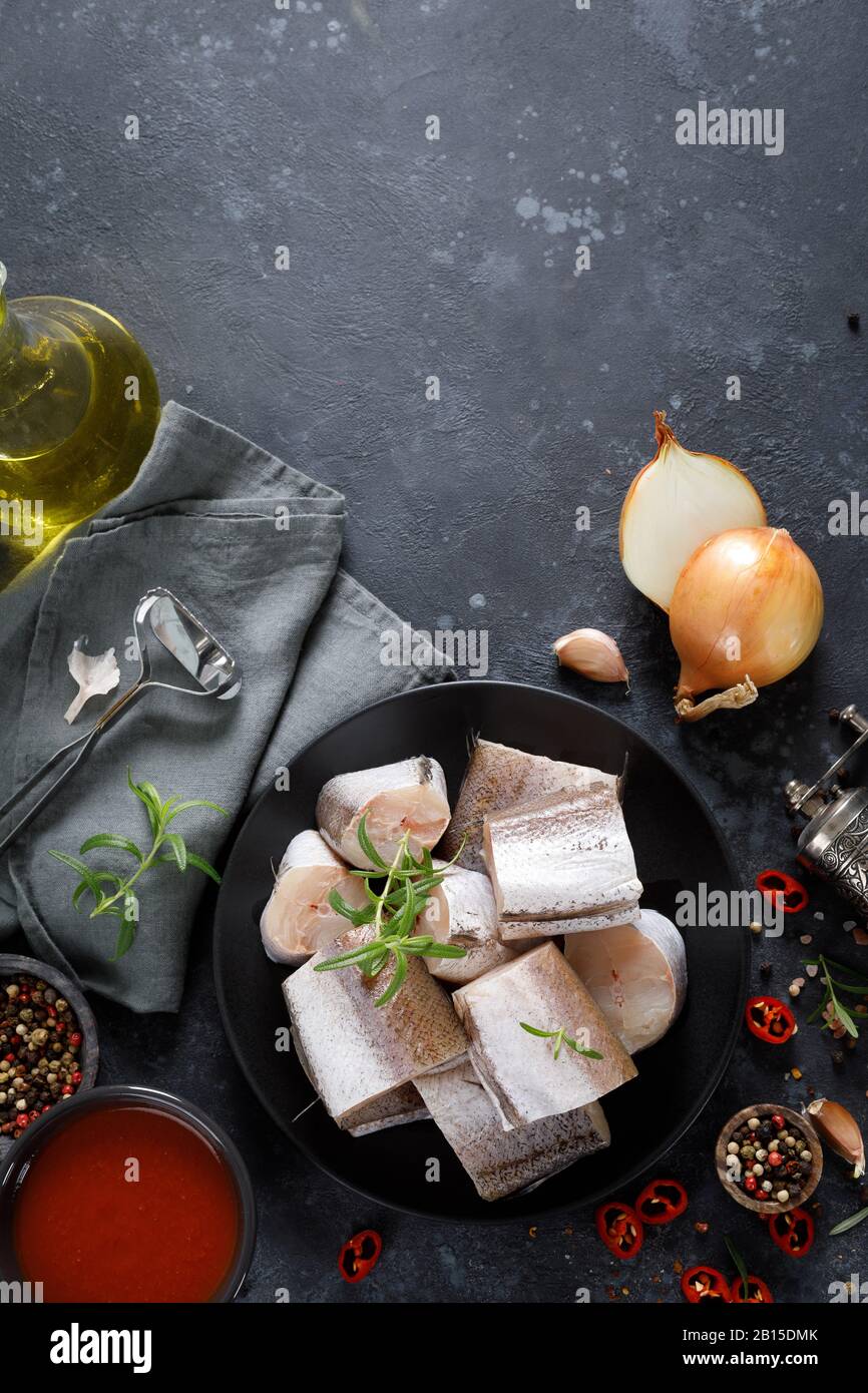 Raw fresh sliced hake fish with ingredients for cooking Stock Photo - Alamy