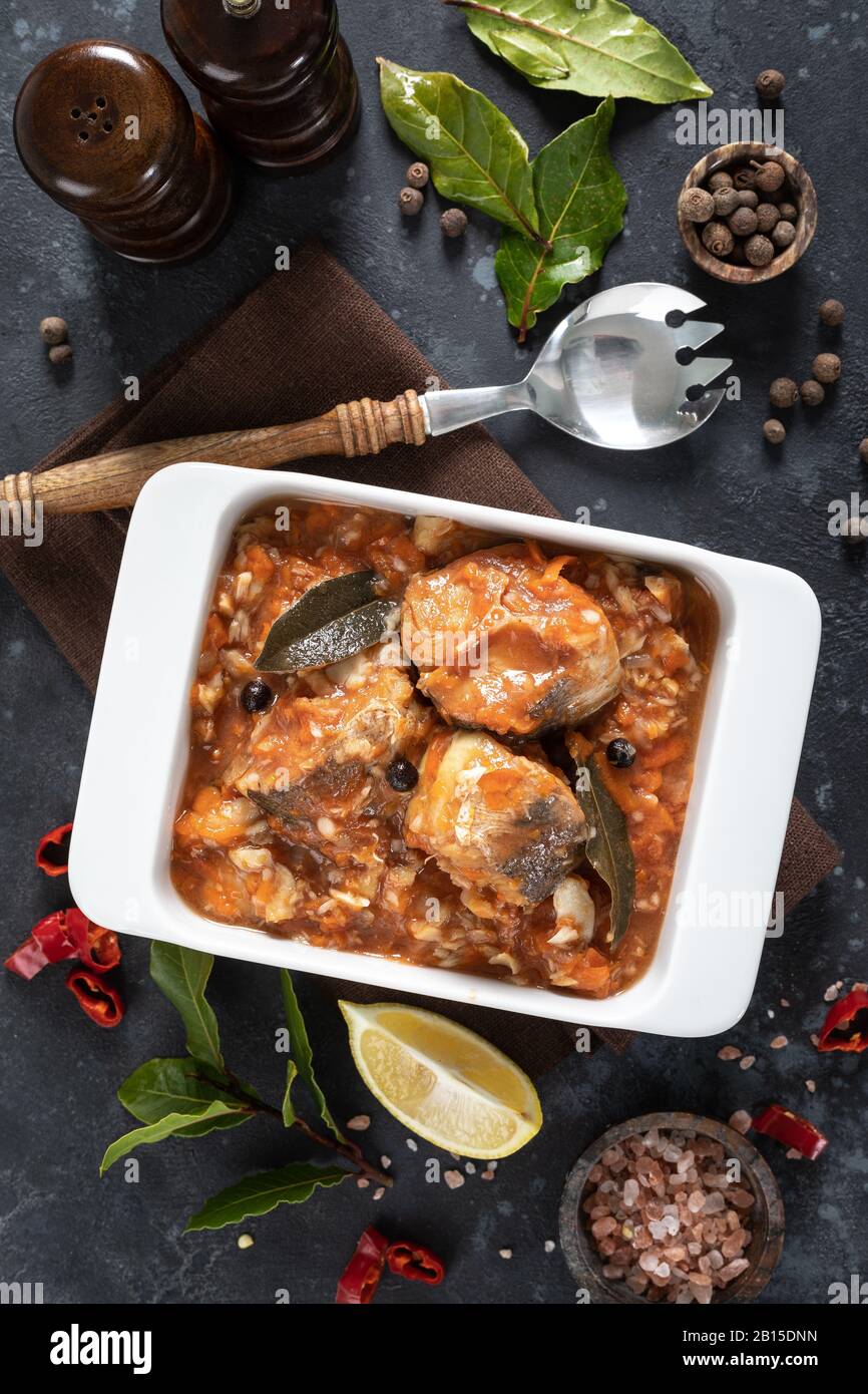 Hake fish, cooked in tomato sauce with vegetables and spices Stock ...