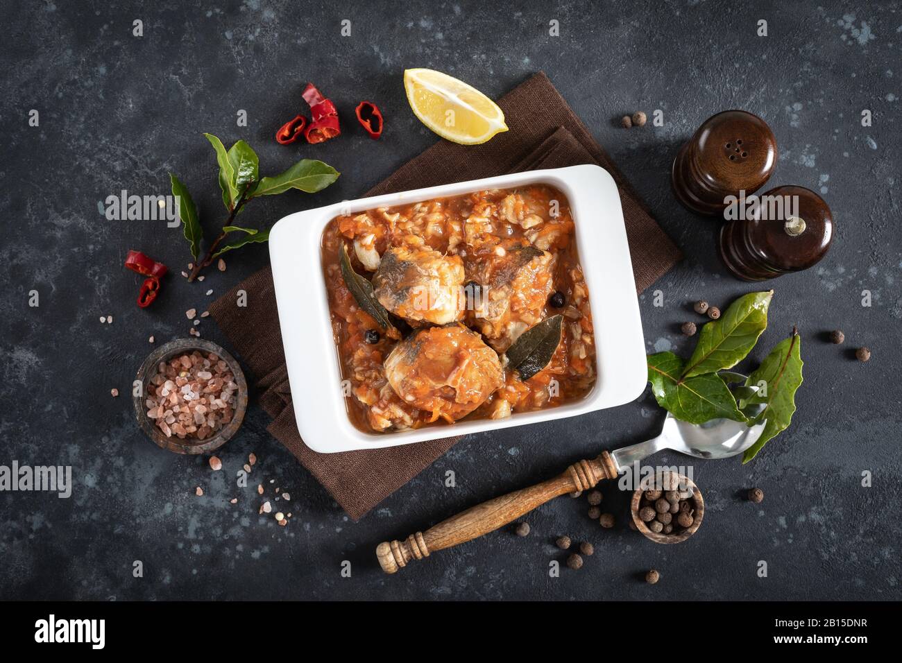 Hake fish, cooked in tomato sauce with vegetables and spices Stock ...