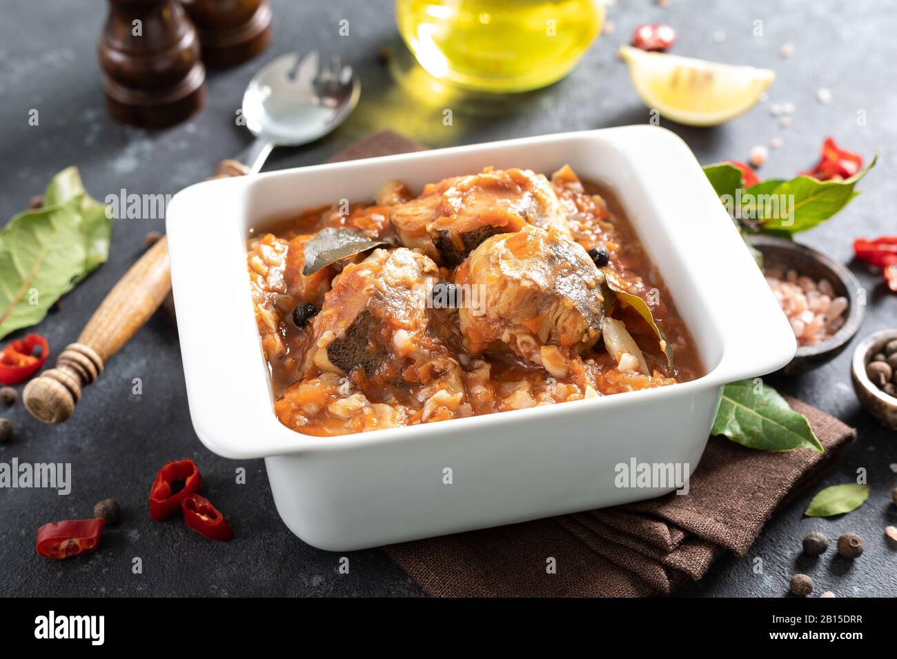 Hake fish, cooked in tomato sauce with vegetables and spices Stock ...