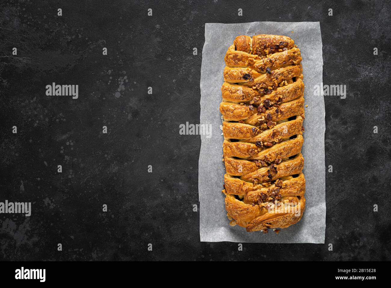 Homemade chocolate puff pastry braided strudel, pie with pecan nuts and ...