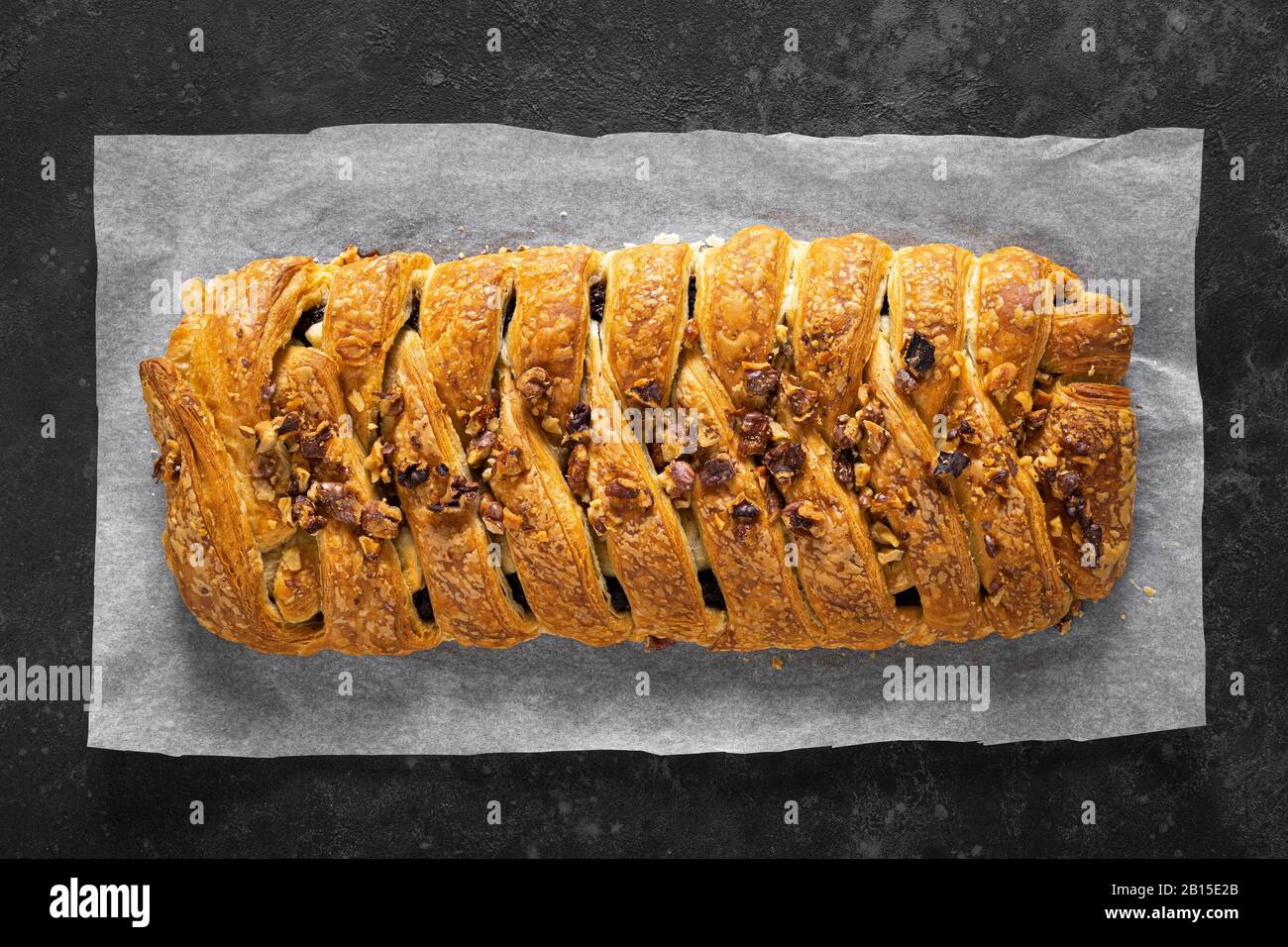 Homemade chocolate puff pastry braided strudel, pie with pecan nuts and ...