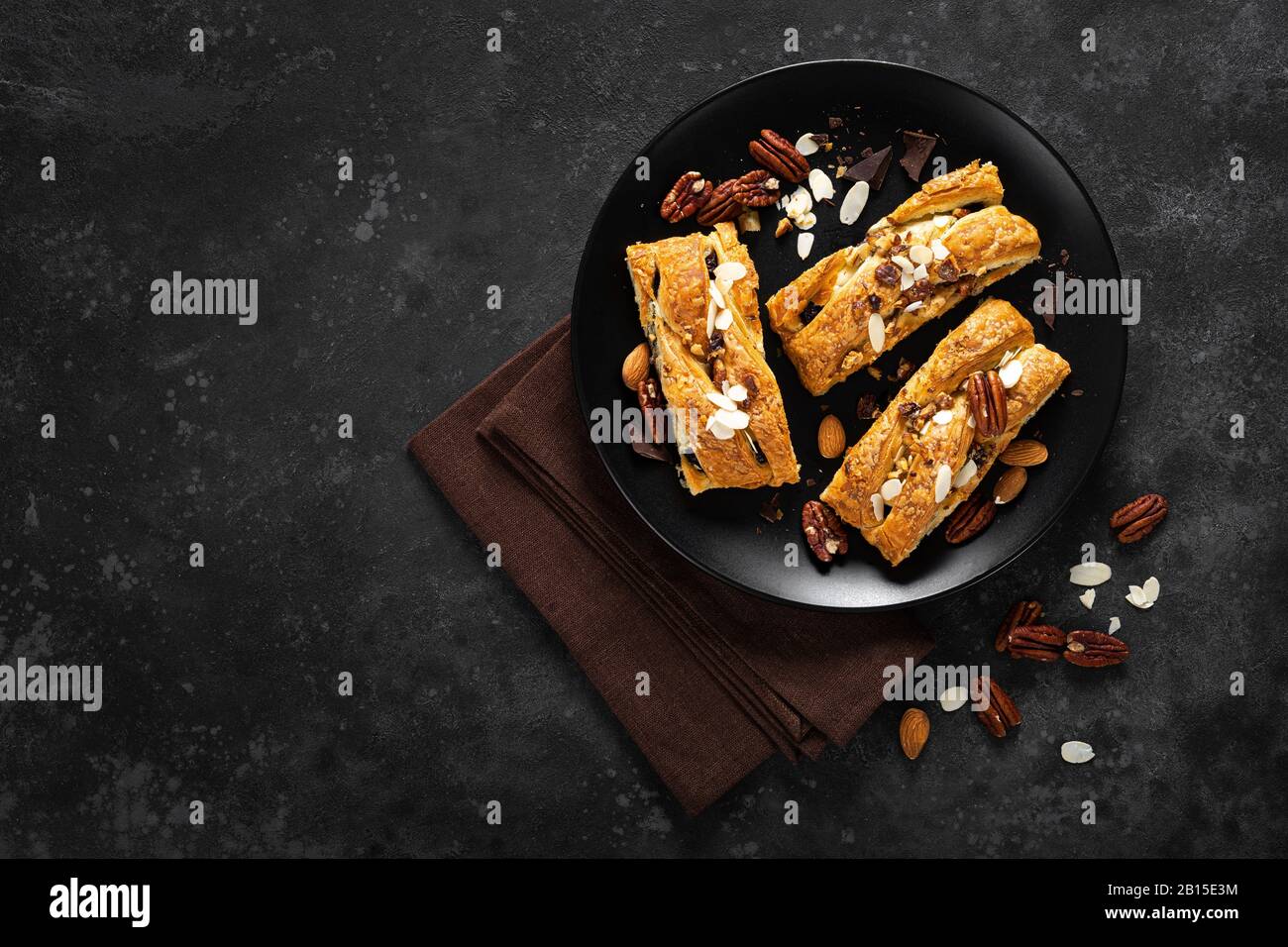 Homemade chocolate puff pastry braided strudel, pie with pecan nuts and ...
